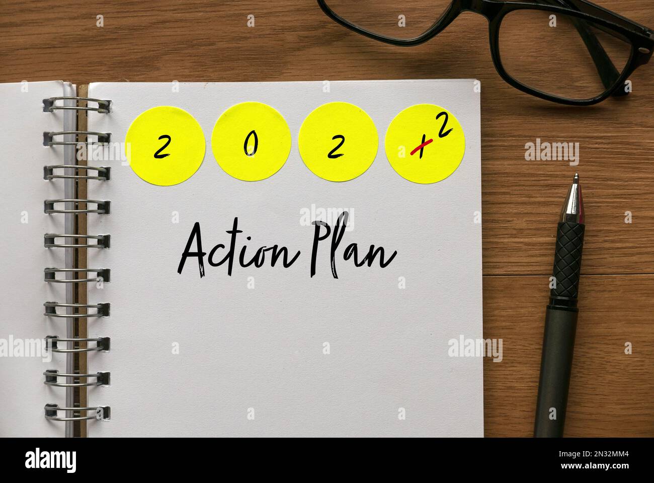 Green label sticker written with Year 2022 on a notebook written with ...