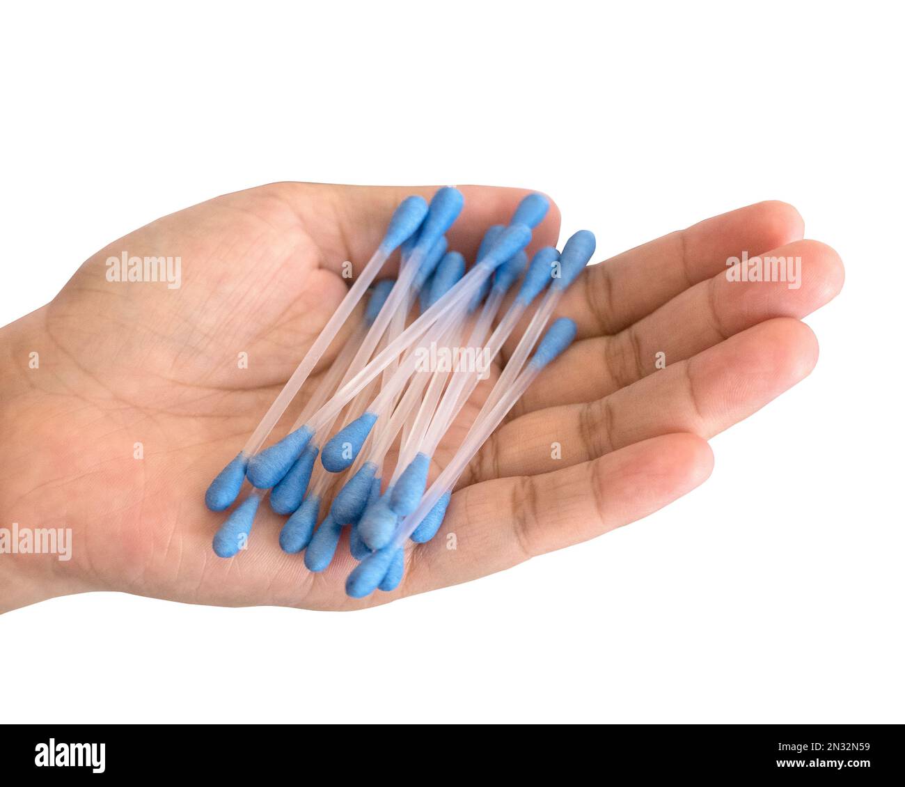 A hand holding cotton buds isolated on a white background Stock Photo ...