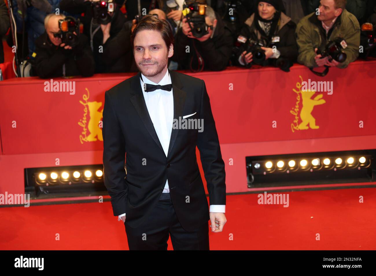 German actor Daniel Bruehl poses for photographers upon arrival at the ...