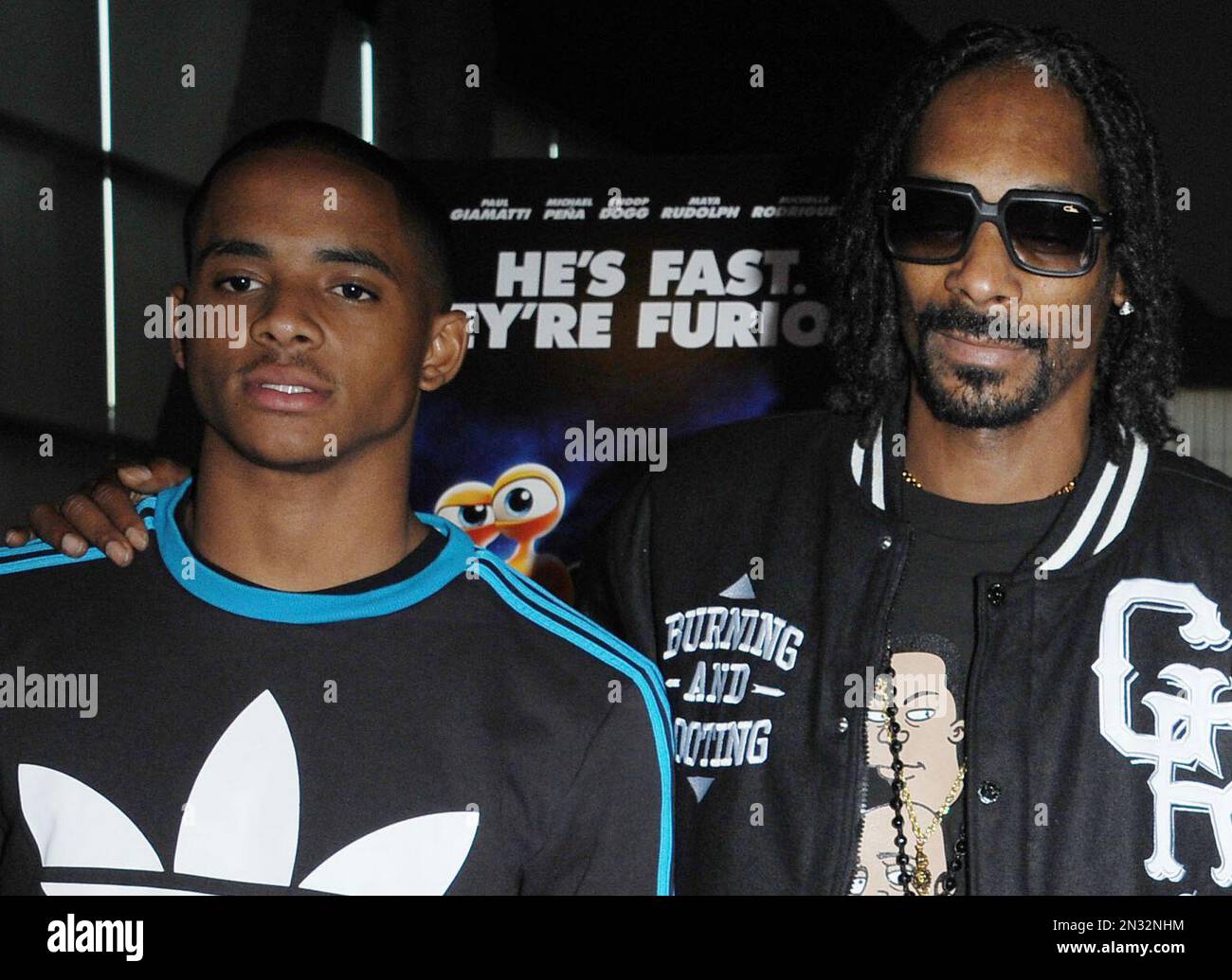 In this Tuesday, July 16, 2013 photo, Snoop Dogg, right, poses with his ...