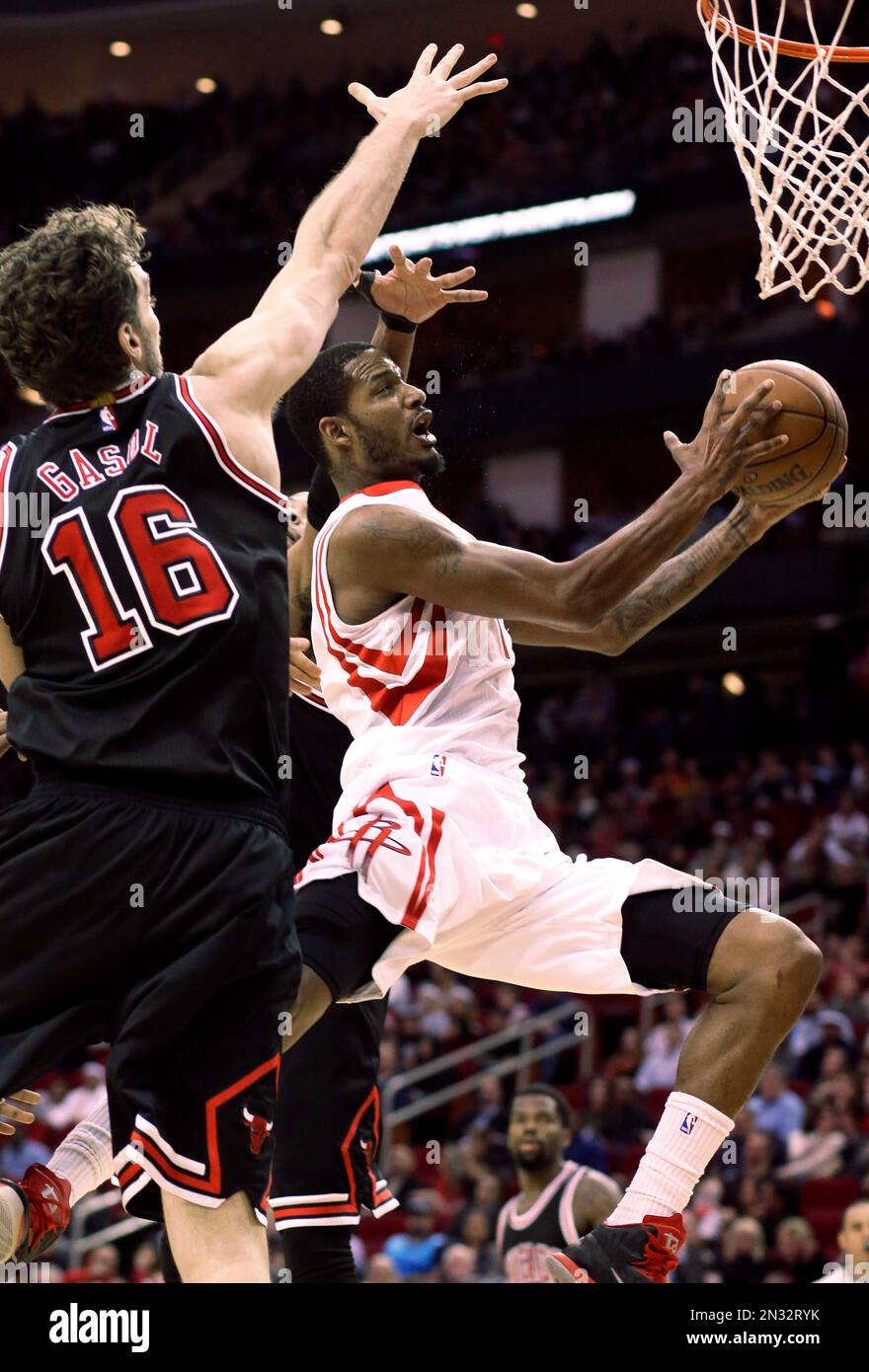 Houston Rockets' Trevor Ariza, right, goes to the basket in front of ...