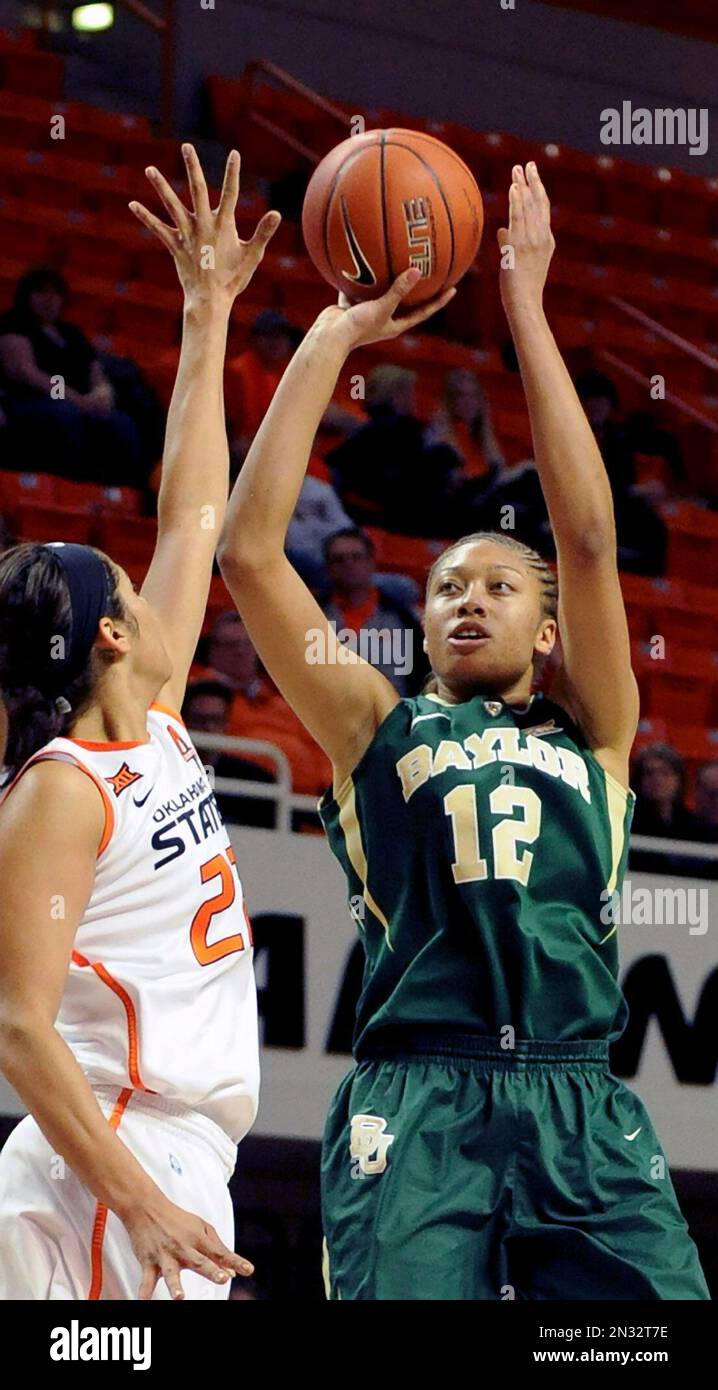 Oklahoma State guard Brittney Martin, left, attempts to block a shot by ...