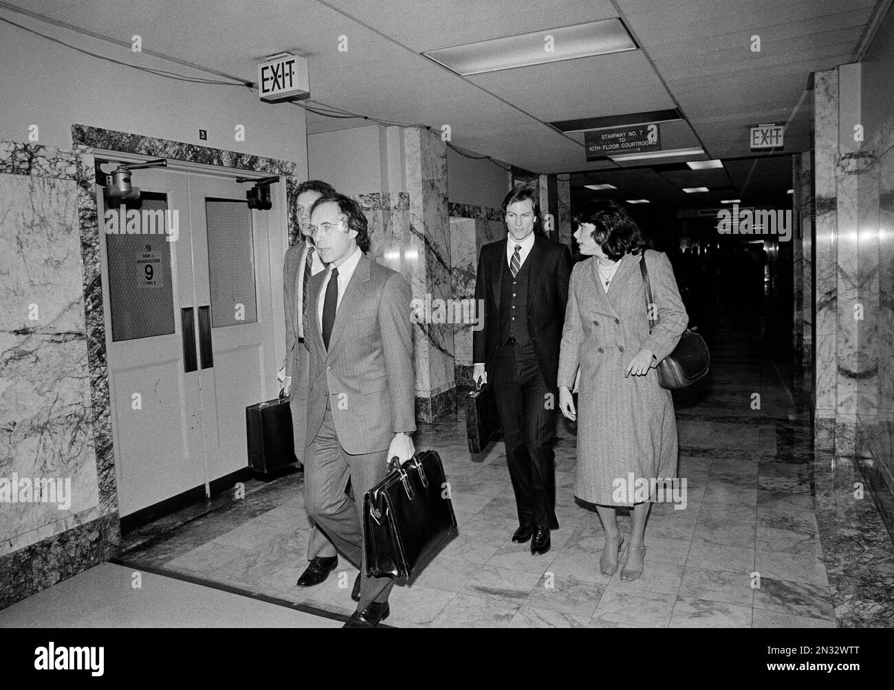 Kevin Coe, at left in dark suit, arrives at Superior Court in Seattle ...