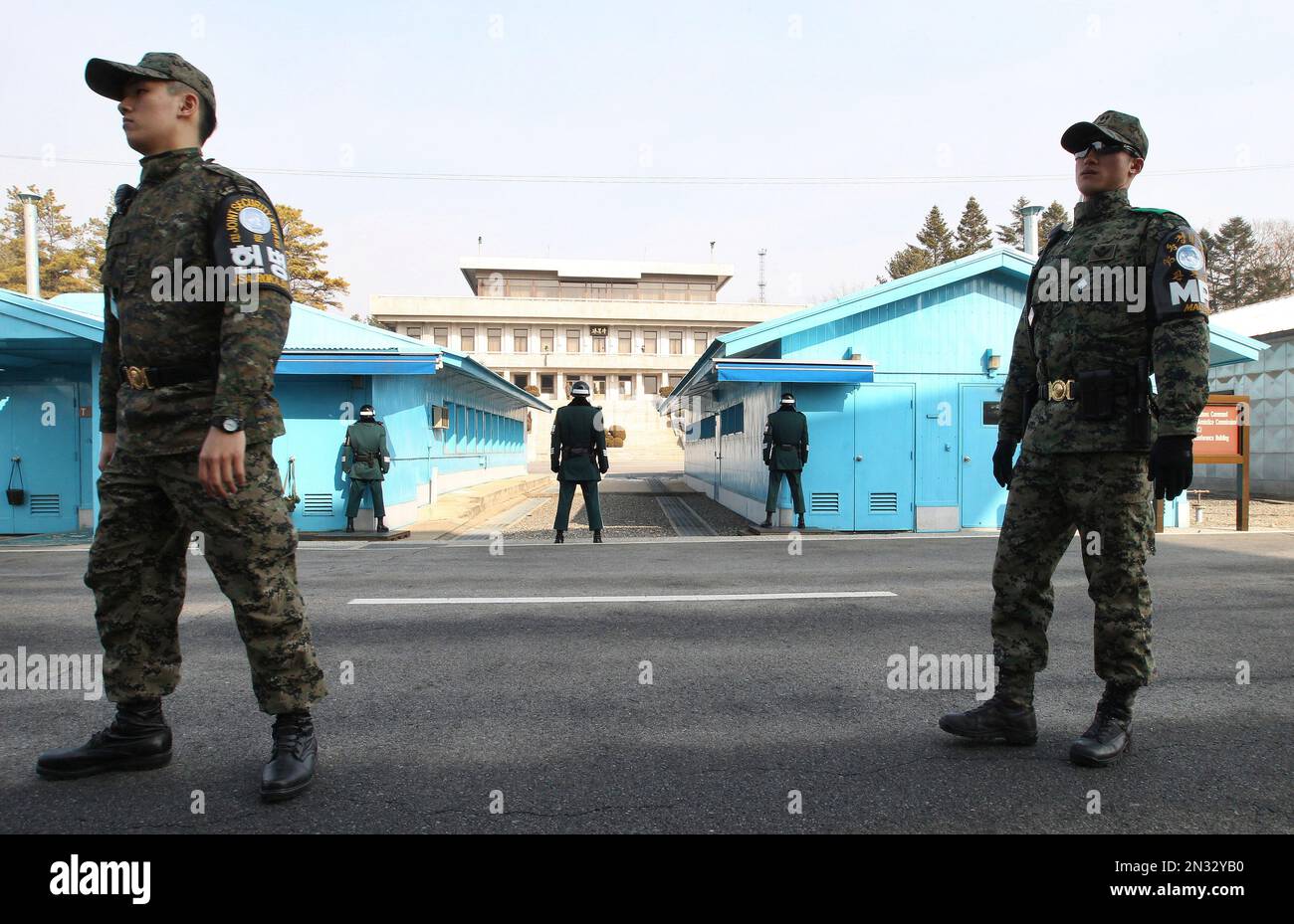 South Korean army soldiers stand guard at the border village of ...