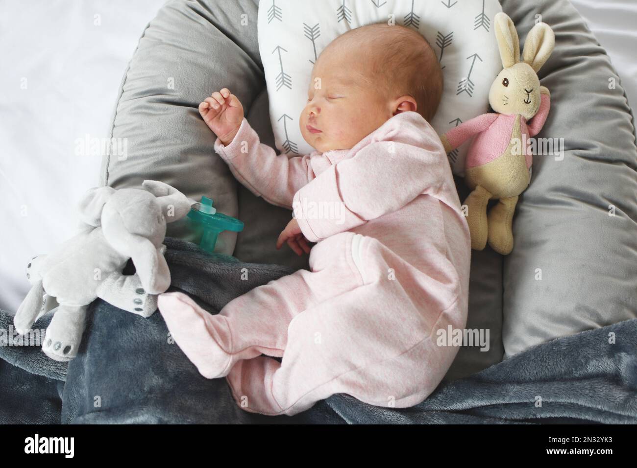 Sleeping white caucasian newborn baby closeup. Angel's kiss, stork bite ...