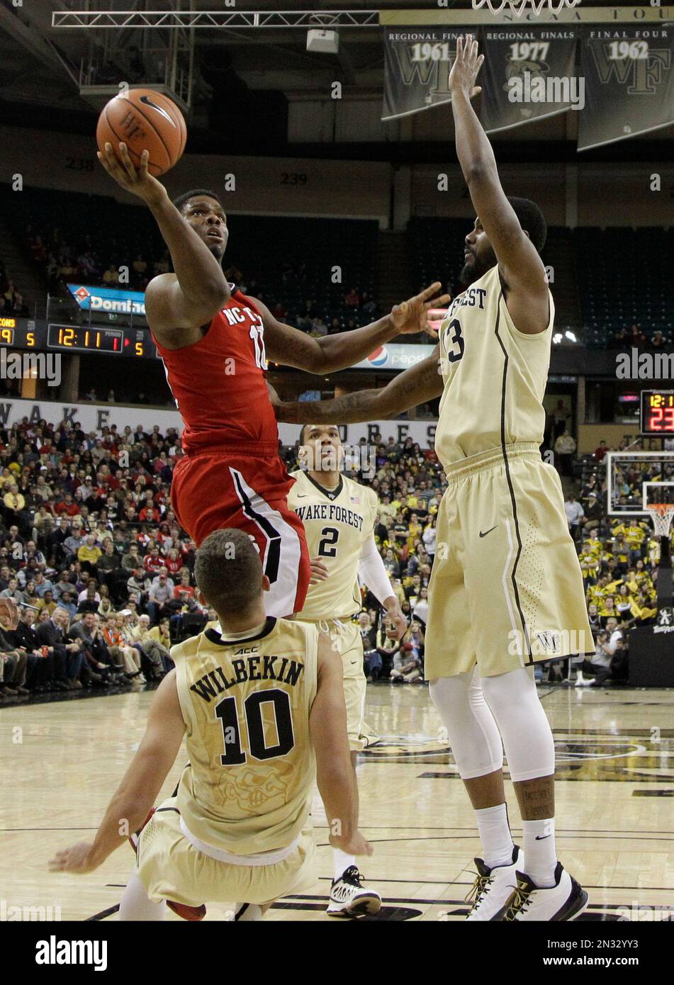 North Carolina State's Lennard Freeman, top left, shoots over Wake ...