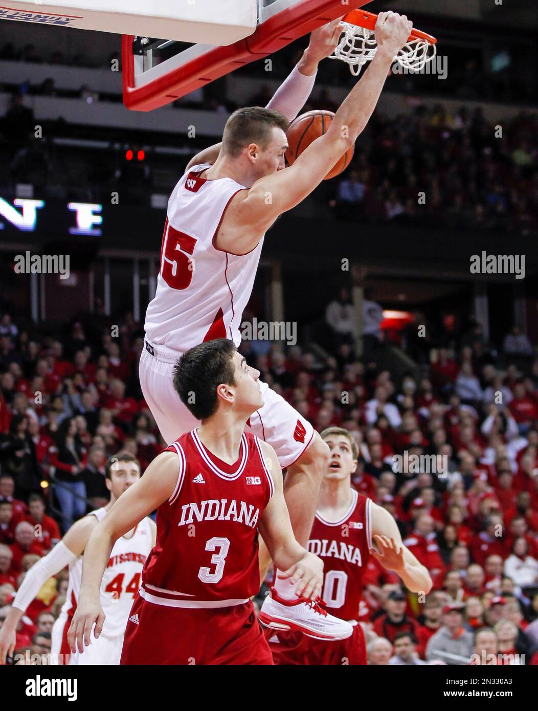 Wisconsin's Sam Dekker dunks over Indiana's Max Hoetzel (3) and Collin ...