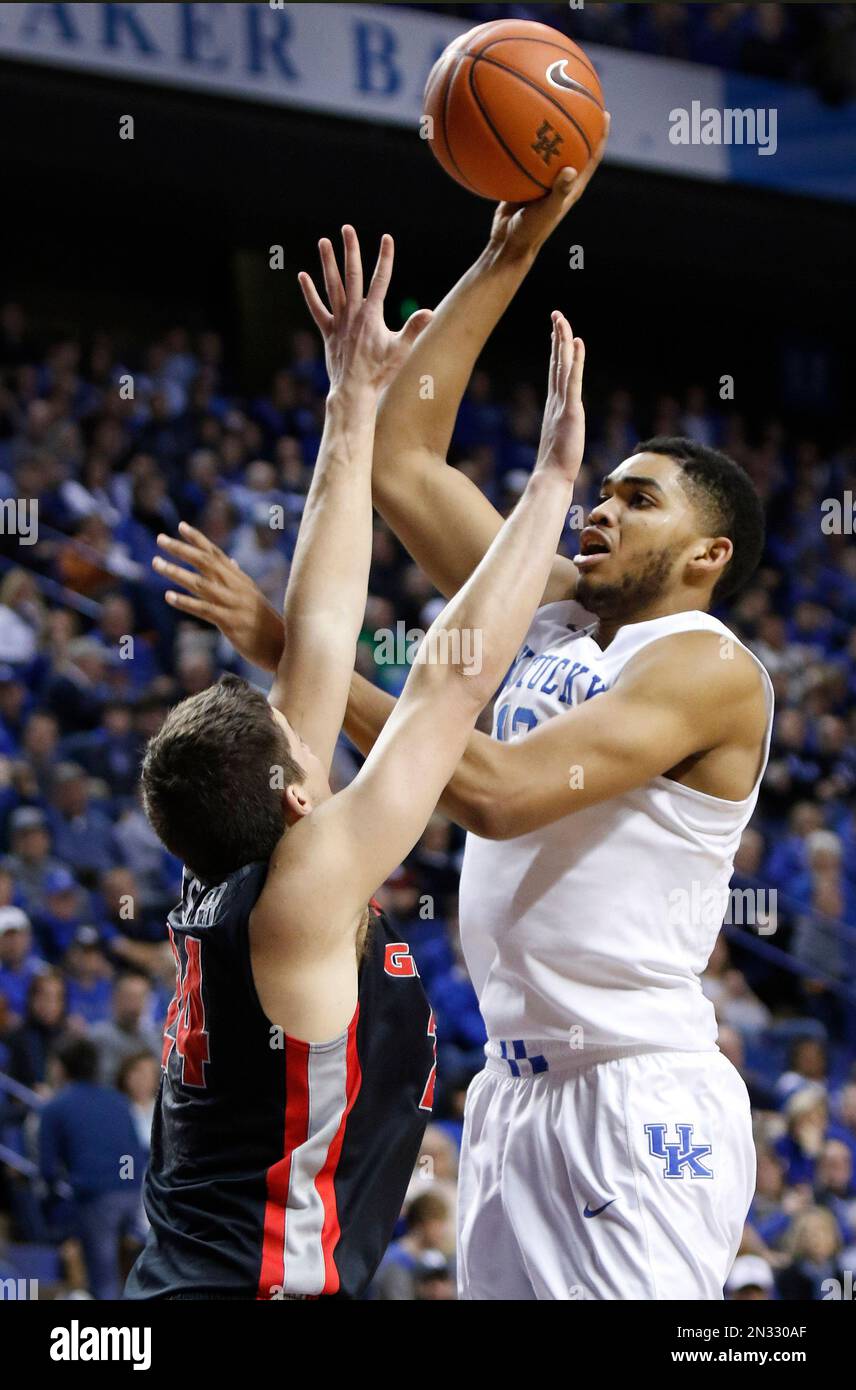 Kentucky's Karl-Anthony Towns, right, shoots under pressure from ...