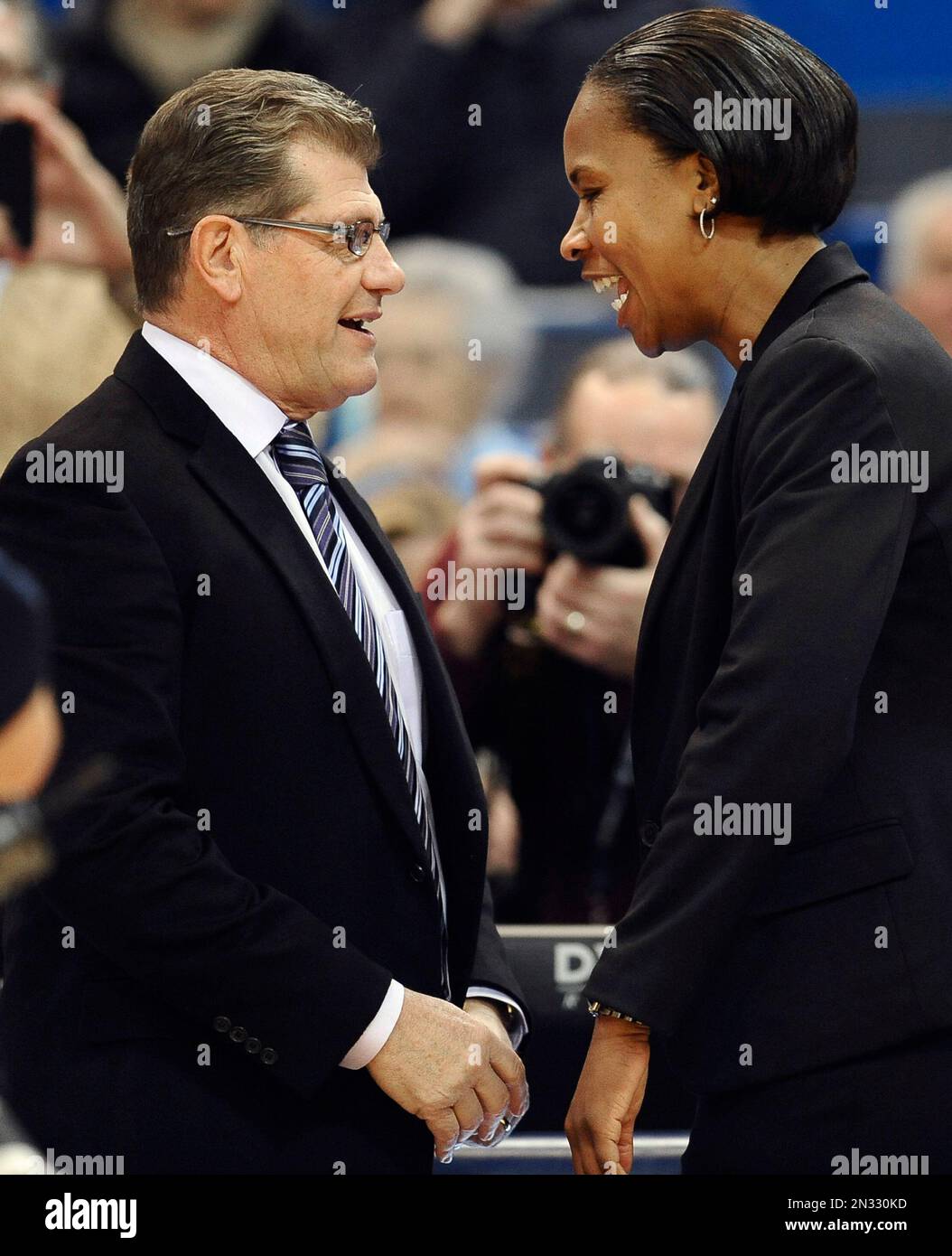 Connecticut coach Geno Auriemma, left, greets Cincinnati coach Jamelle ...