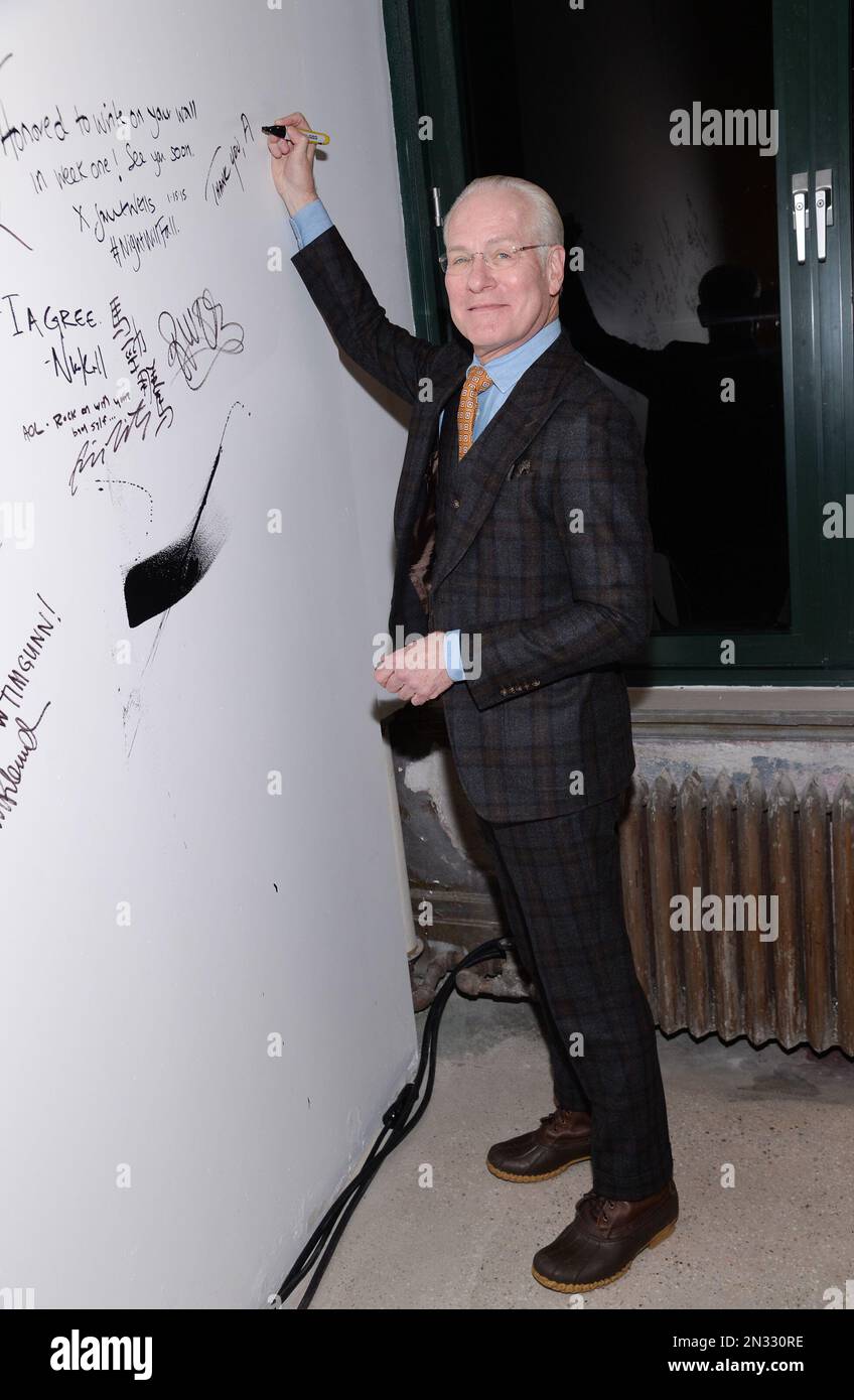 Television personality Tim Gunn signs the guest wall at AOL's BUILD ...