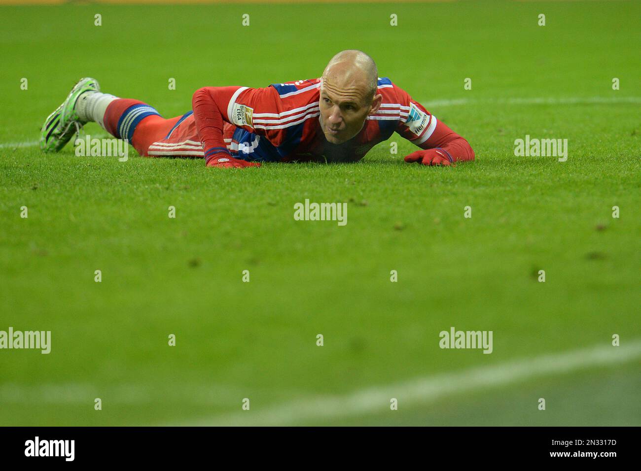 Bayern's Arjen Robben from the Netherlands lies on the pitch during the ...