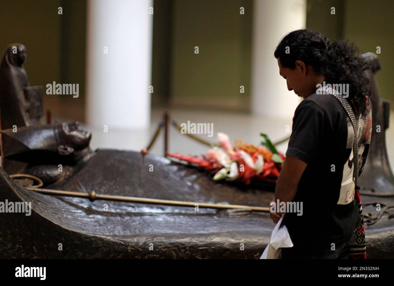 FILE - In this March 23, 2011, file photo, a man prays next to the tomb ...