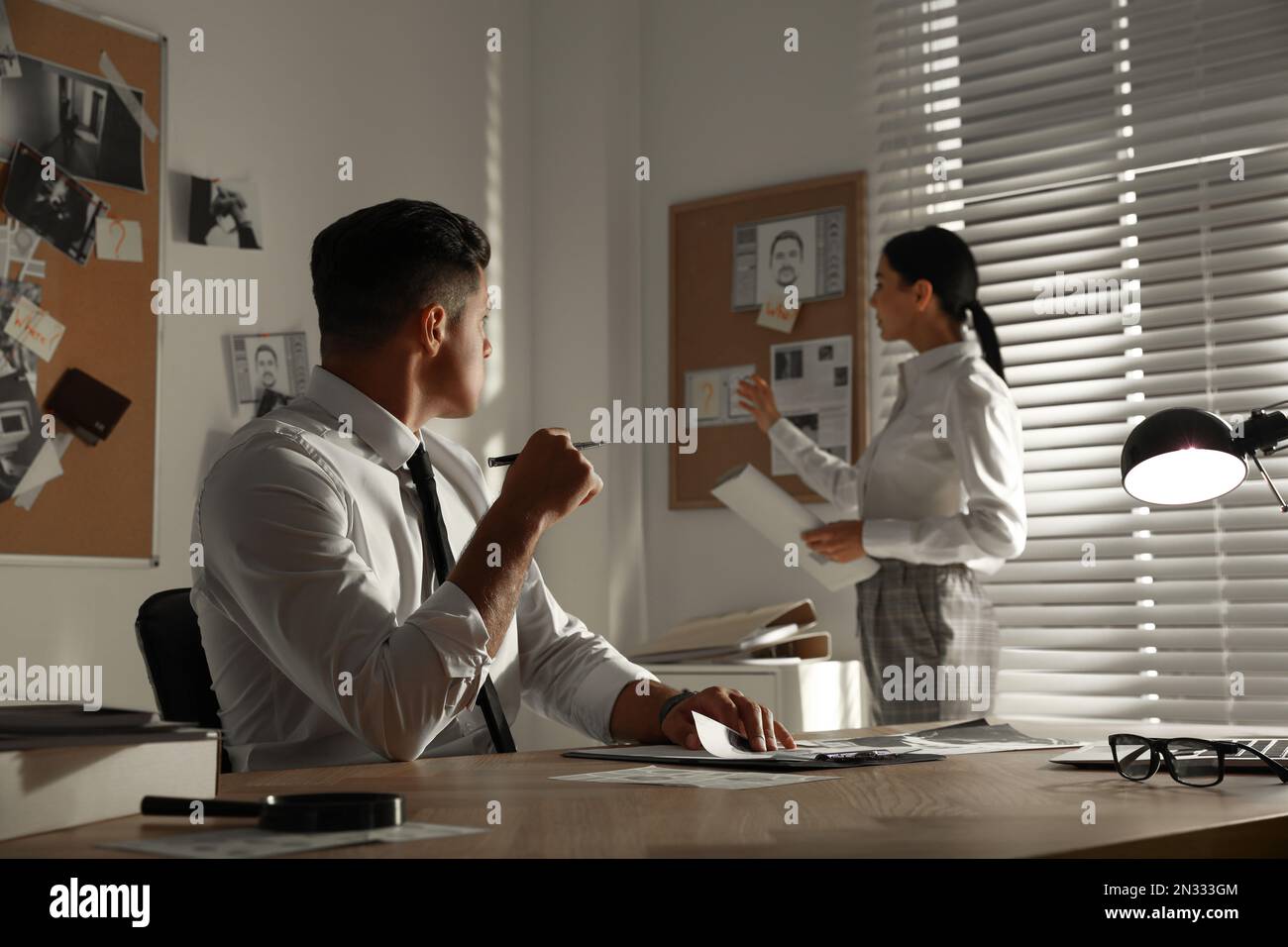 Professional detectives working desk hi-res stock photography and ...