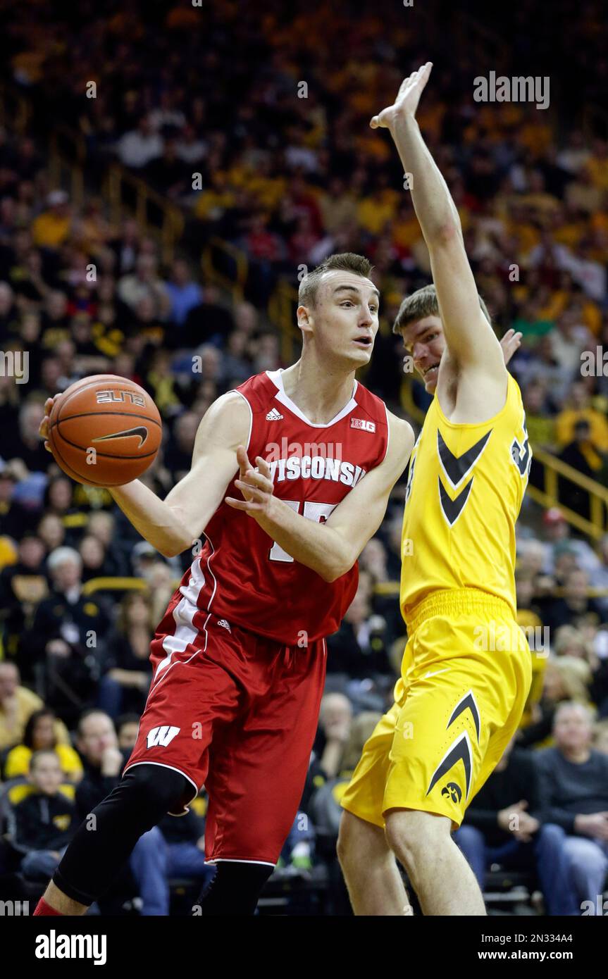 Wisconsin's Sam Dekker (left) passes away from Iowa's Adam Woodbury (34 ...