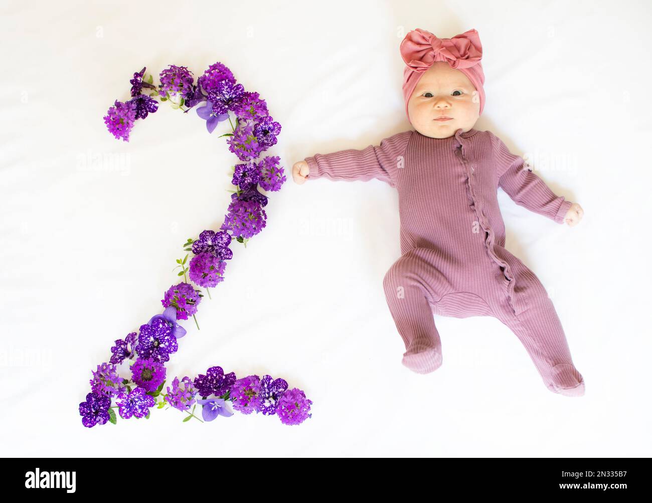 2-month-old baby girl. Baby milestone two months. Two month old baby ...