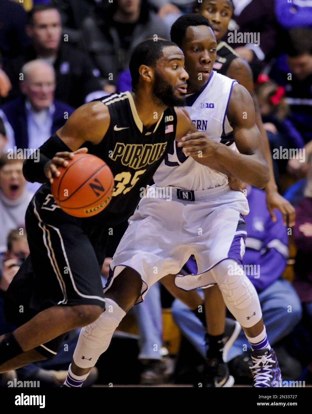 Purdue guard Rapheal Davis (35) passes against Northwestern guard ...