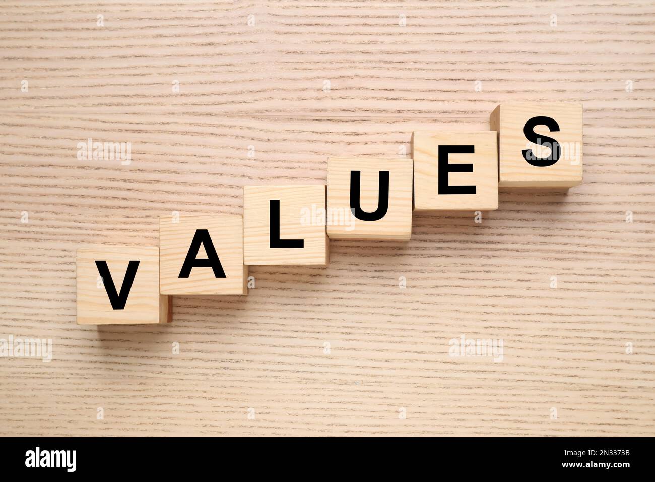 Cubes with word VALUES on wooden background, flat lay Stock Photo - Alamy