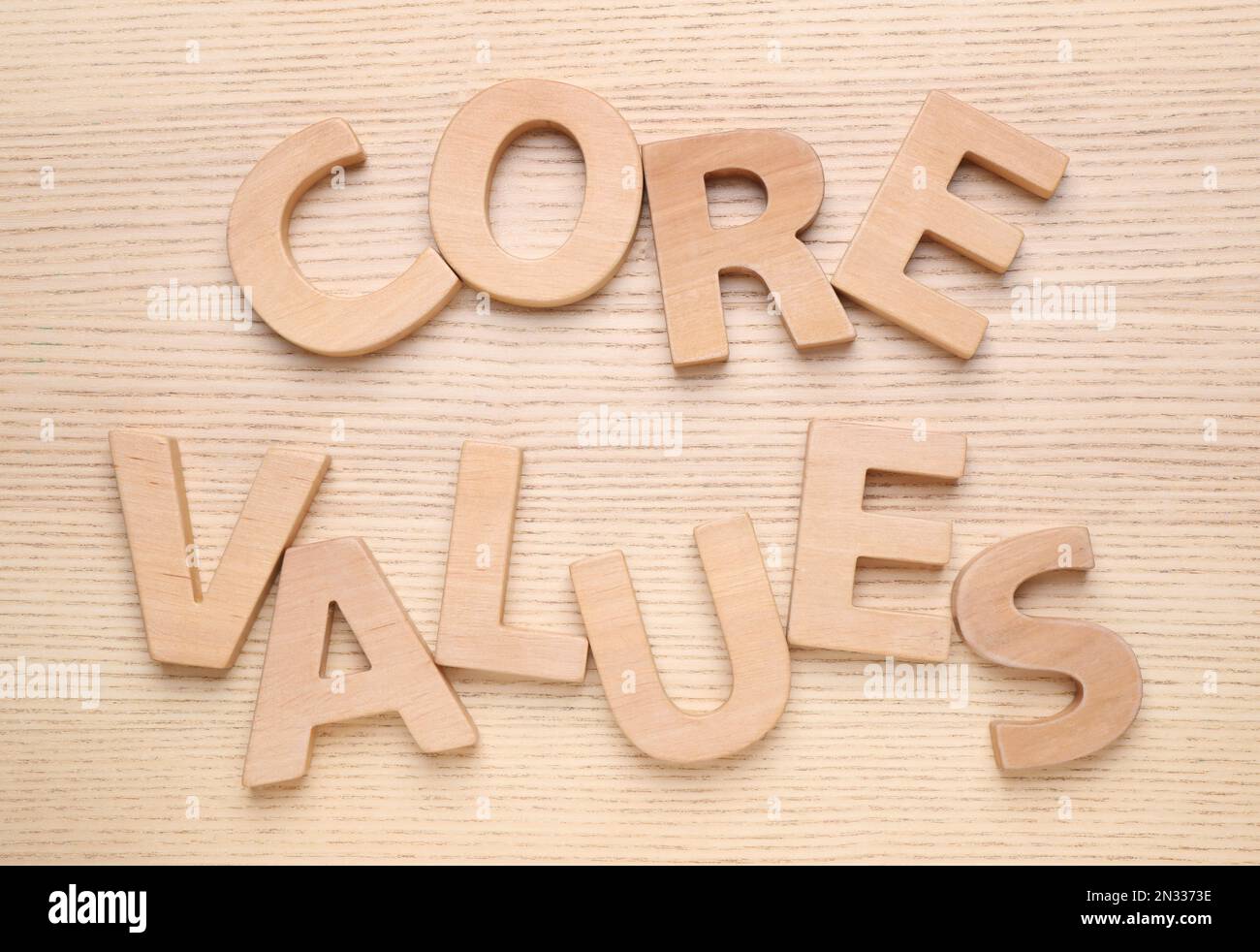 Phrase CORE VALUES made of letters on wooden background, flat lay Stock ...