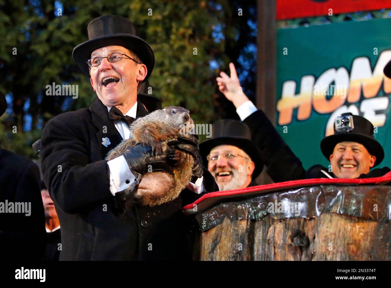 Groundhog Club handler Ron Ploucha, left, holds Punxsutawney Phil, the ...