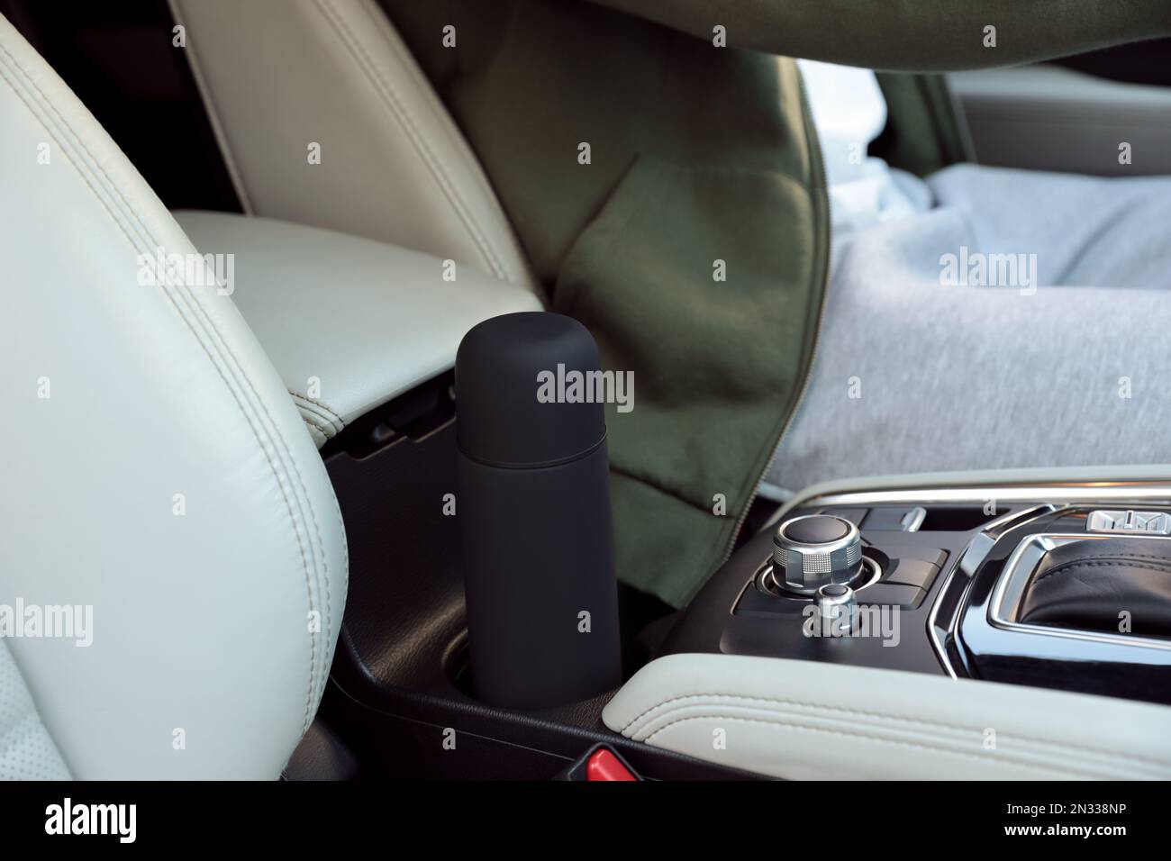 Black thermos in holder inside of car Stock Photo - Alamy