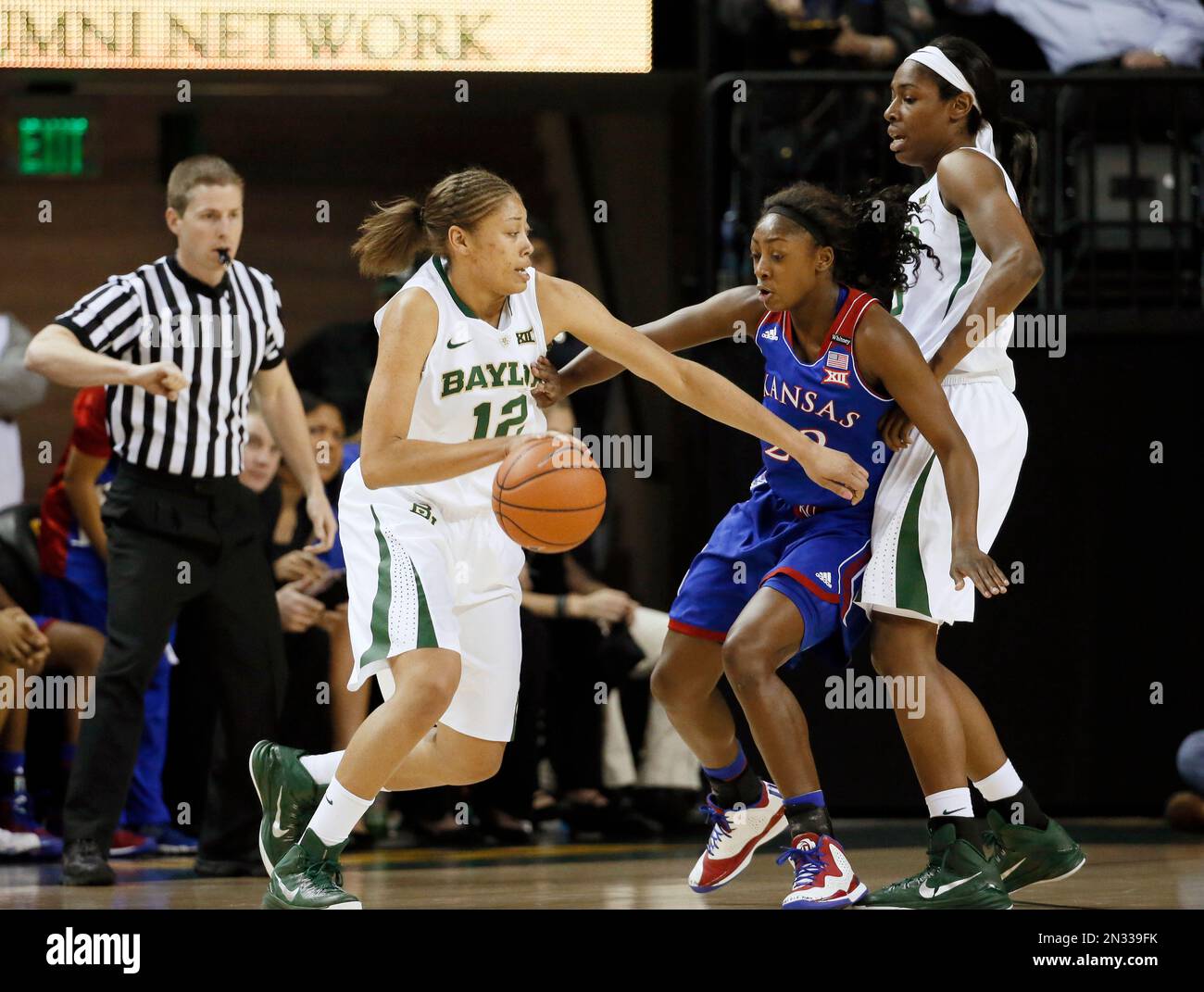 Baylor's Alexis Prince (12) moves around Kansas' Chayla Cheadle (22) as ...
