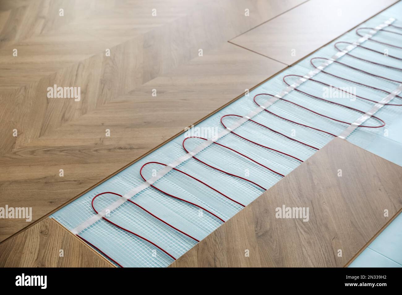 Installation of modern underfloor trace heating system indoors Stock ...