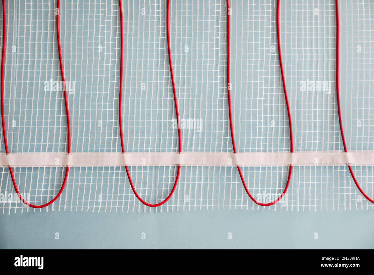 Installation of modern underfloor trace heating system indoors, top ...