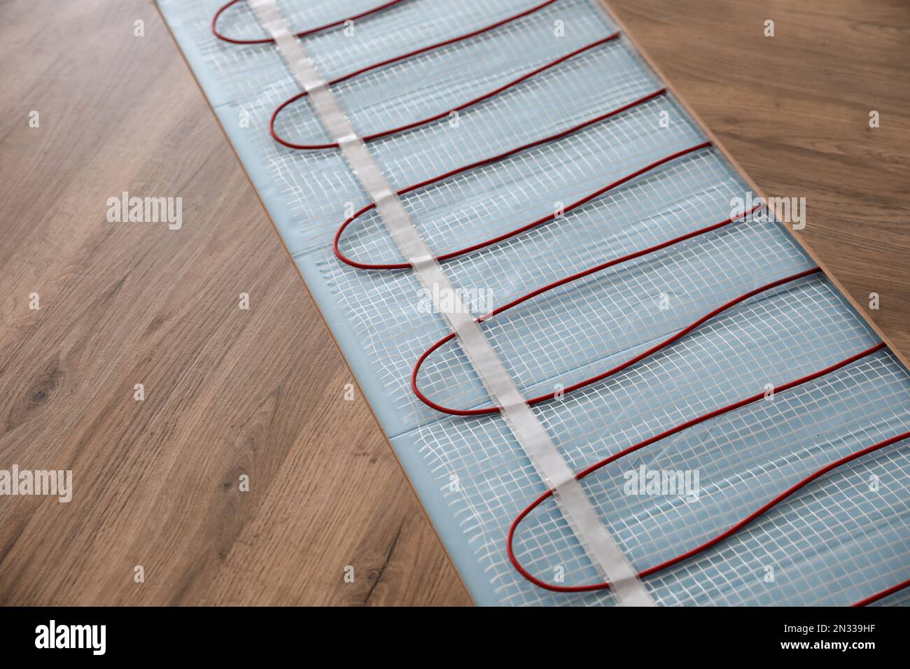 Installation of modern underfloor trace heating system indoors Stock ...