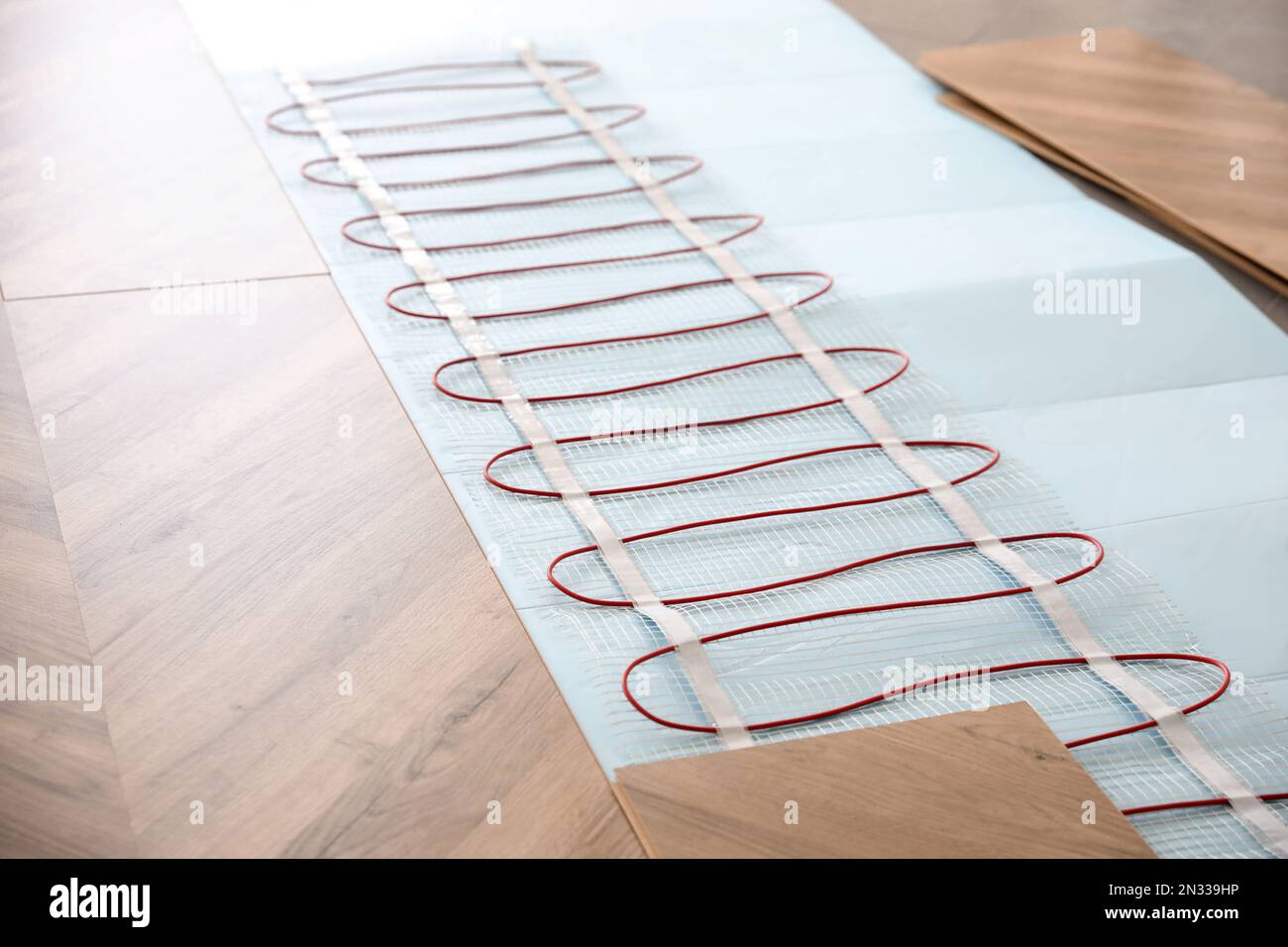 Installation of modern underfloor trace heating system indoors Stock ...