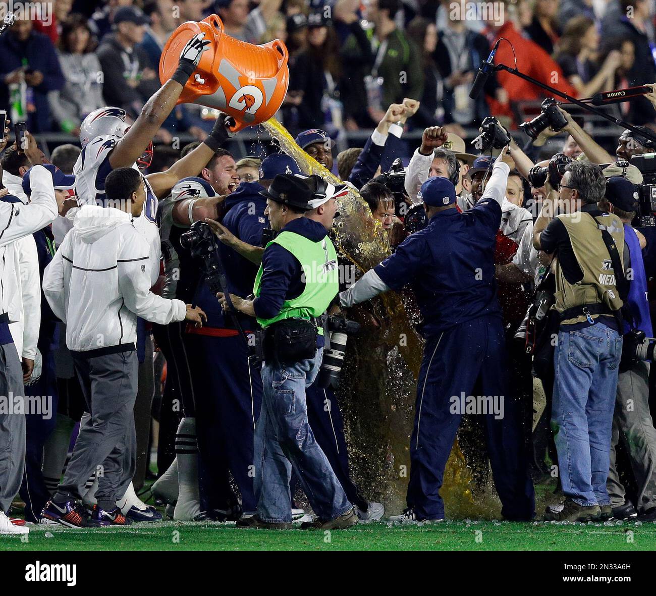 Players dump gatorade on the New England Patriots head coach Bill ...