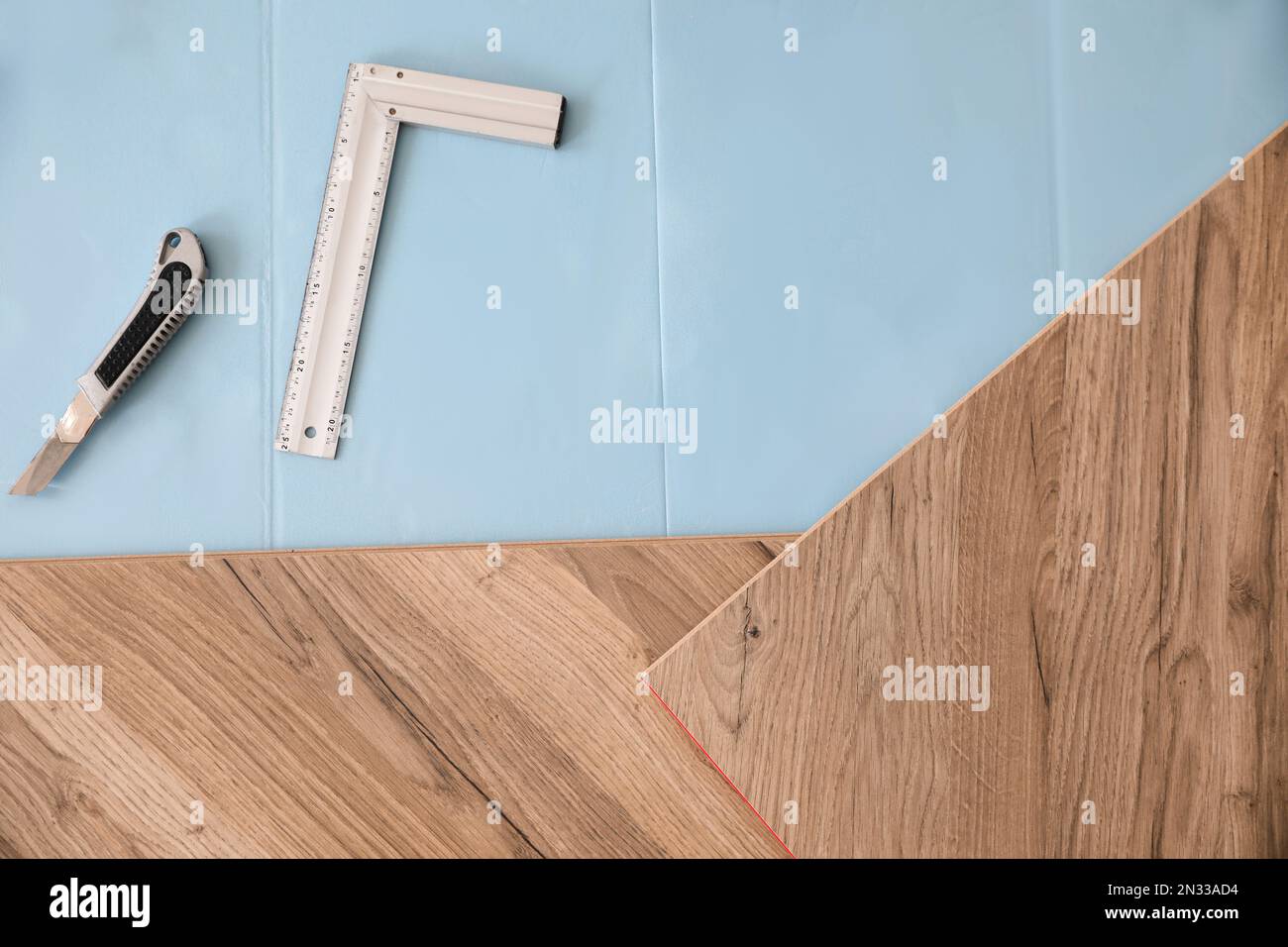 Installation of laminated wooden floor at home, top view Stock Photo ...