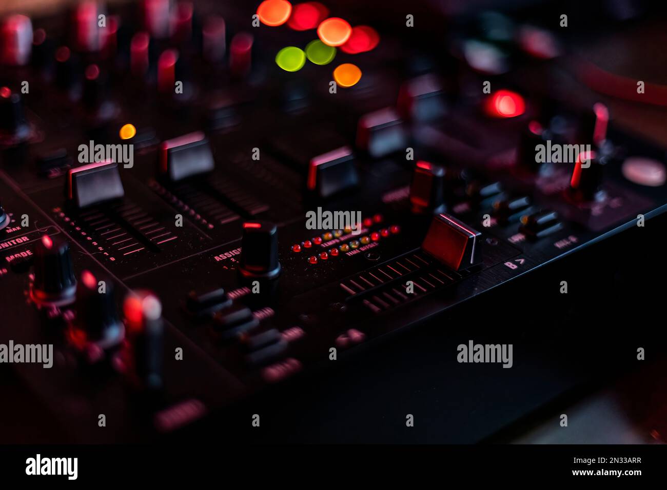 Close-up of an audio mixer with knobs and buttons, perfect for music ...