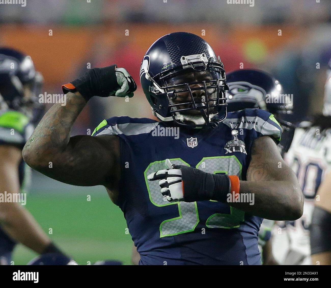 Seattle Seahawks defensive tackle Tony McDaniel (99) flexes his arm ...