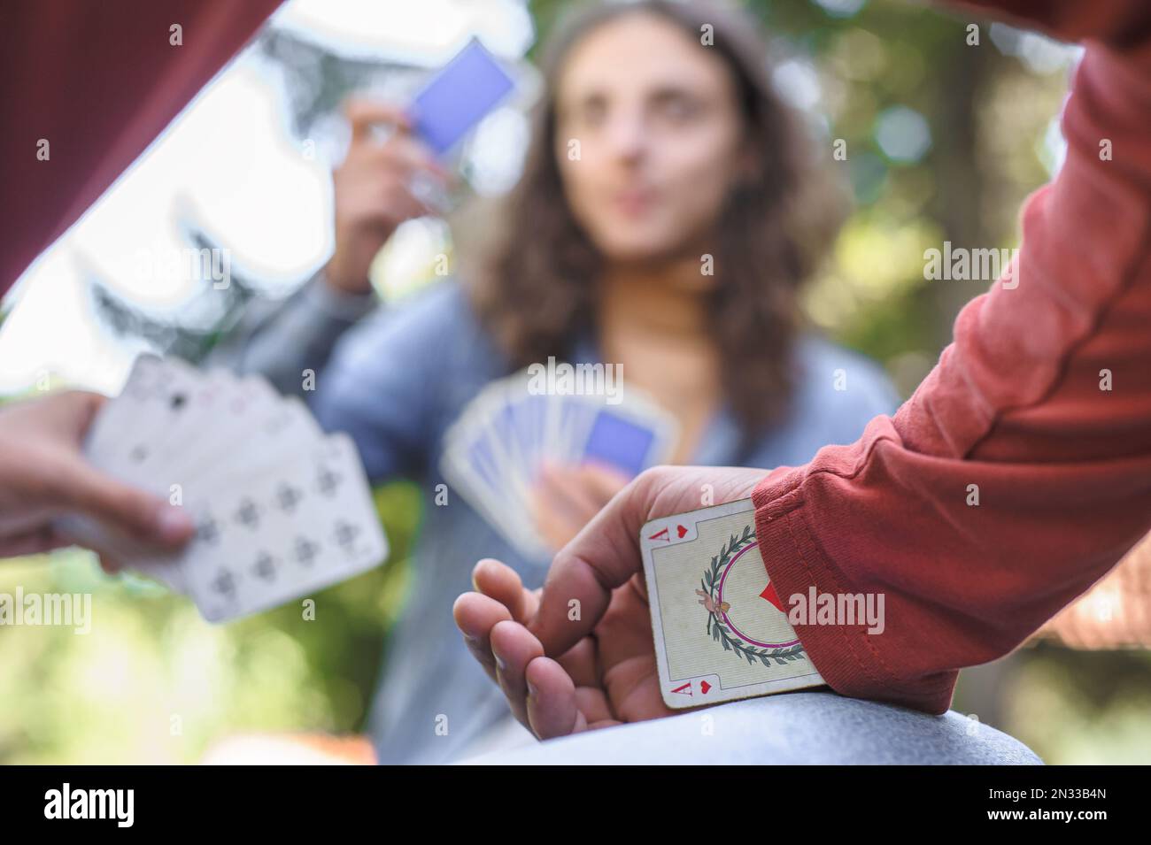 Playing cards ace hand sleeve hi-res stock photography and images - Alamy