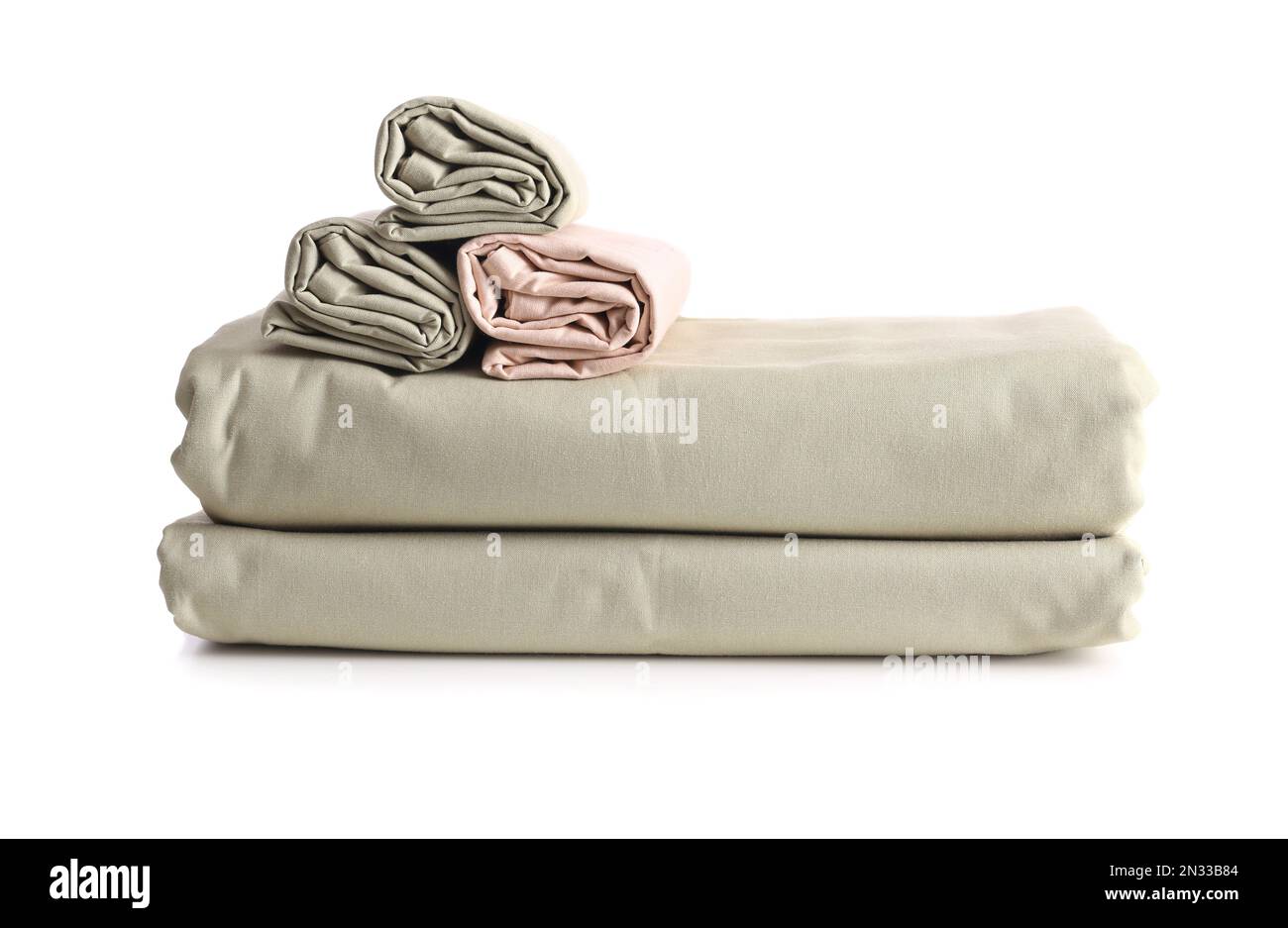 Stack of clean bed sheets isolated on white Stock Photo - Alamy