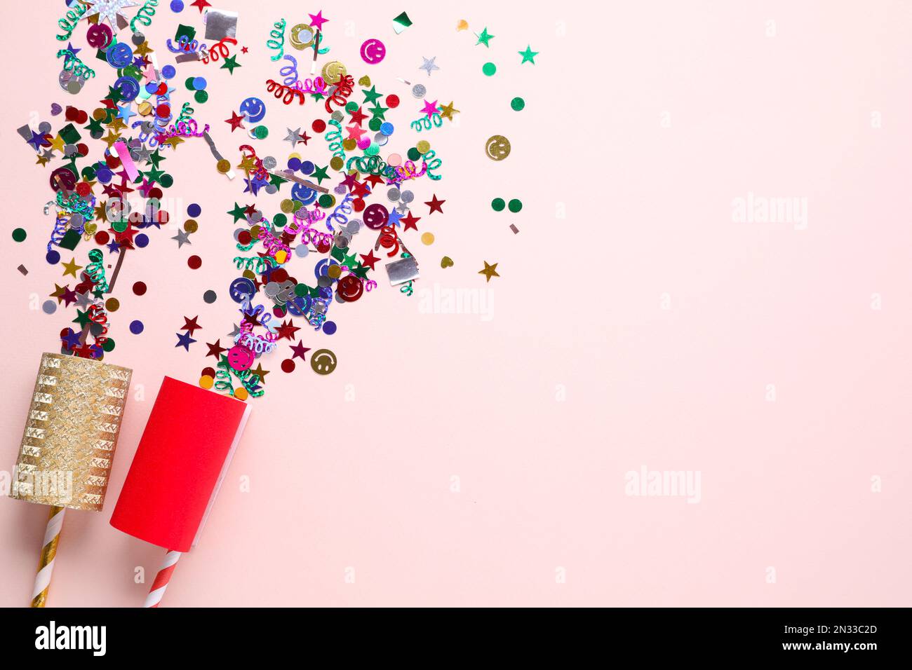 Flat lay composition of colorful confetti and party crackers on white ...
