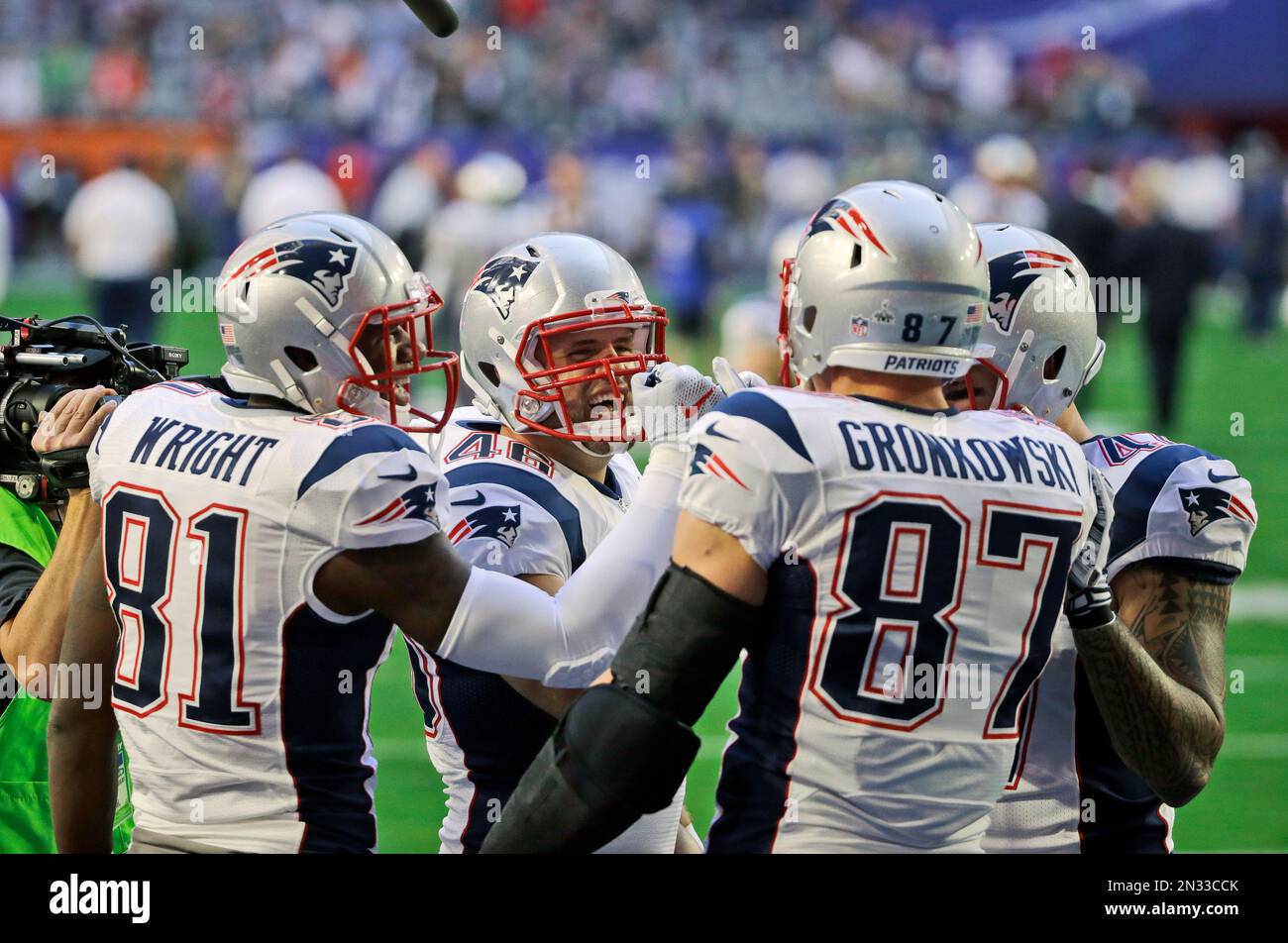 New England Patriots fullback James Develin (46), center, greets ...