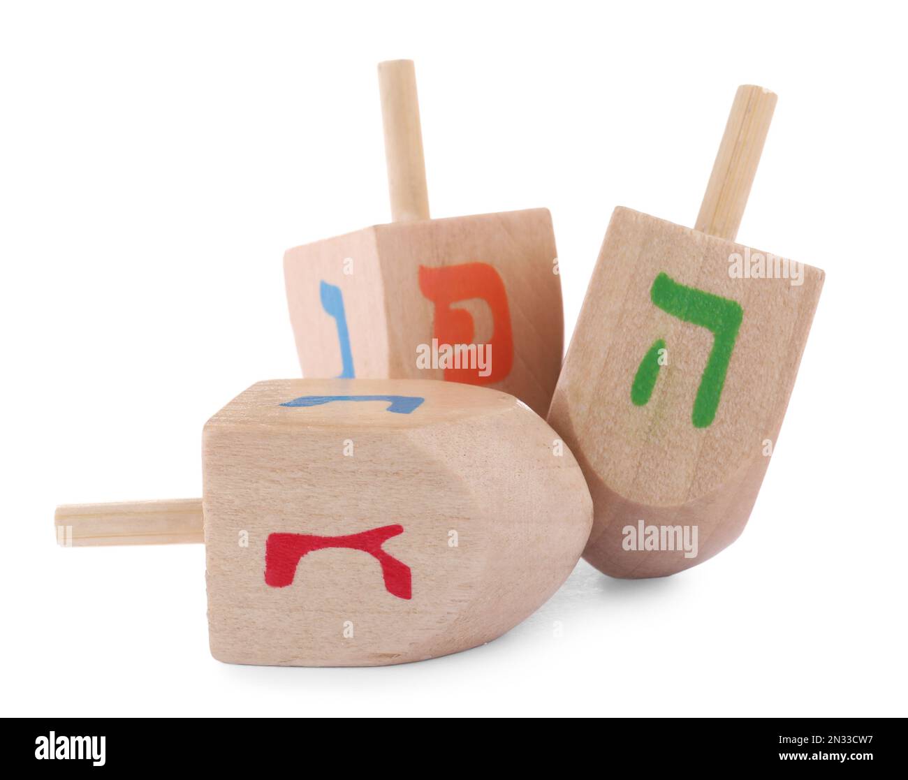 Wooden Hanukkah traditional dreidels on white background Stock Photo ...