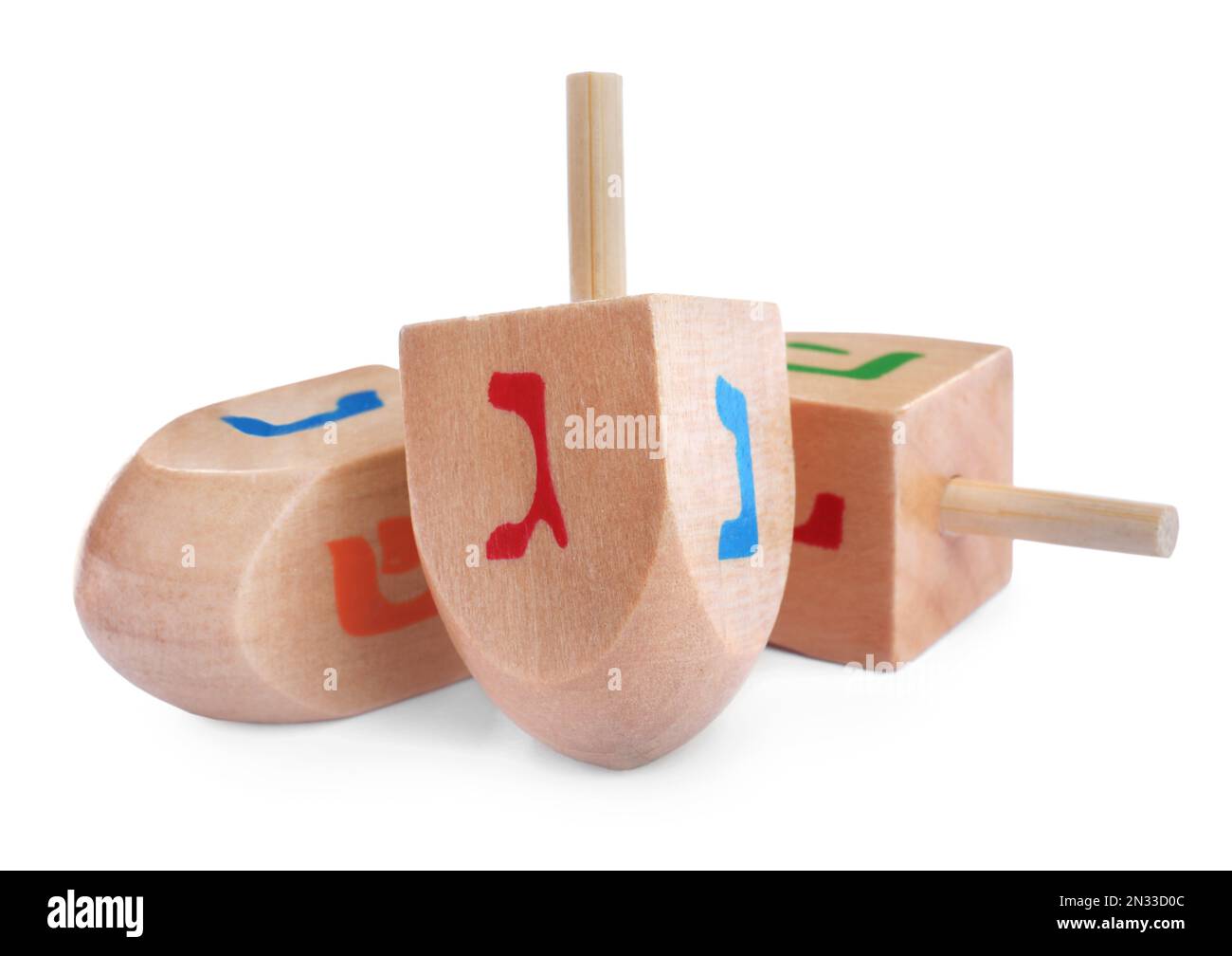 Wooden Hanukkah traditional dreidels on white background Stock Photo ...