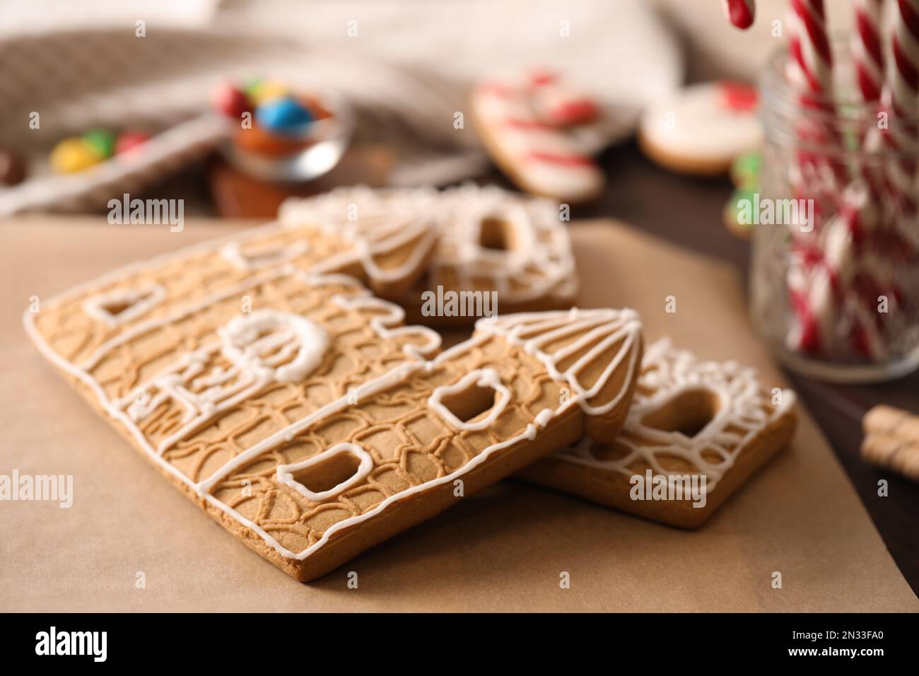 Parts of gingerbread house on parchment, closeup Stock Photo - Alamy