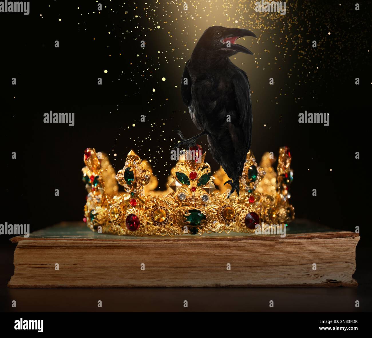 Fantasy world. Black crow lit by magic light sitting on golden crown ...