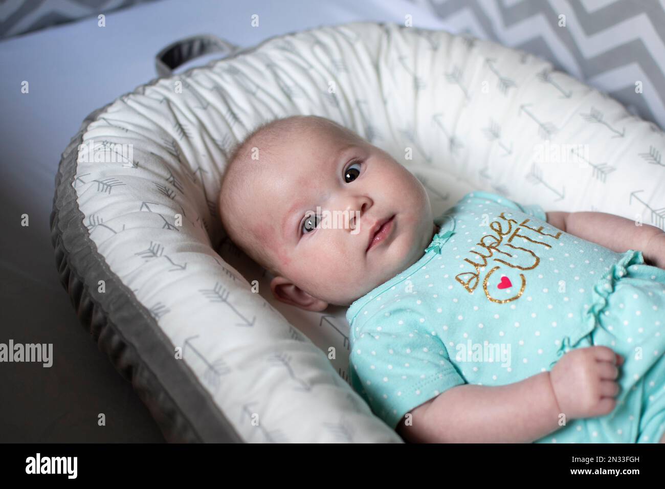 4 months old Caucasian cute baby girl in a crib. Infant girl. Newborn ...
