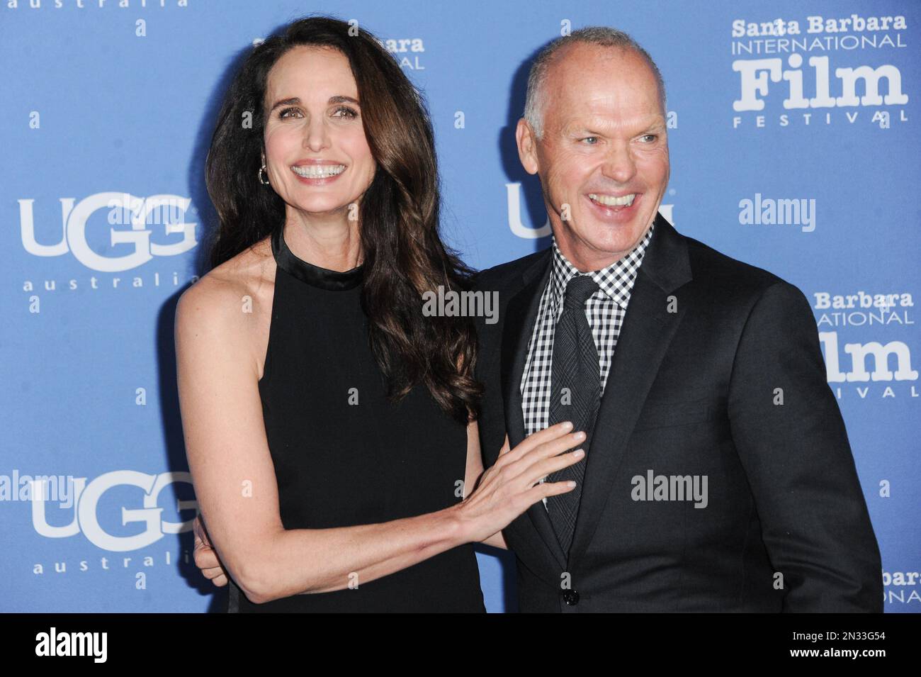 Andie MacDowell, left, and Michael Keaton arrive at the 30th Santa ...