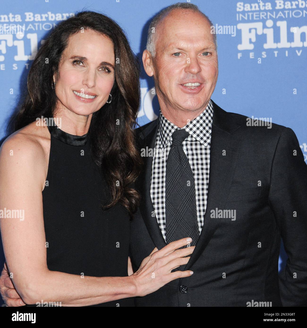 Andie MacDowell, left, and Michael Keaton arrive at the 30th Santa ...
