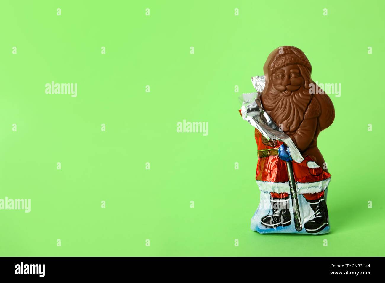 Sweet chocolate Santa Claus candy in slightly open foil wrapper on ...