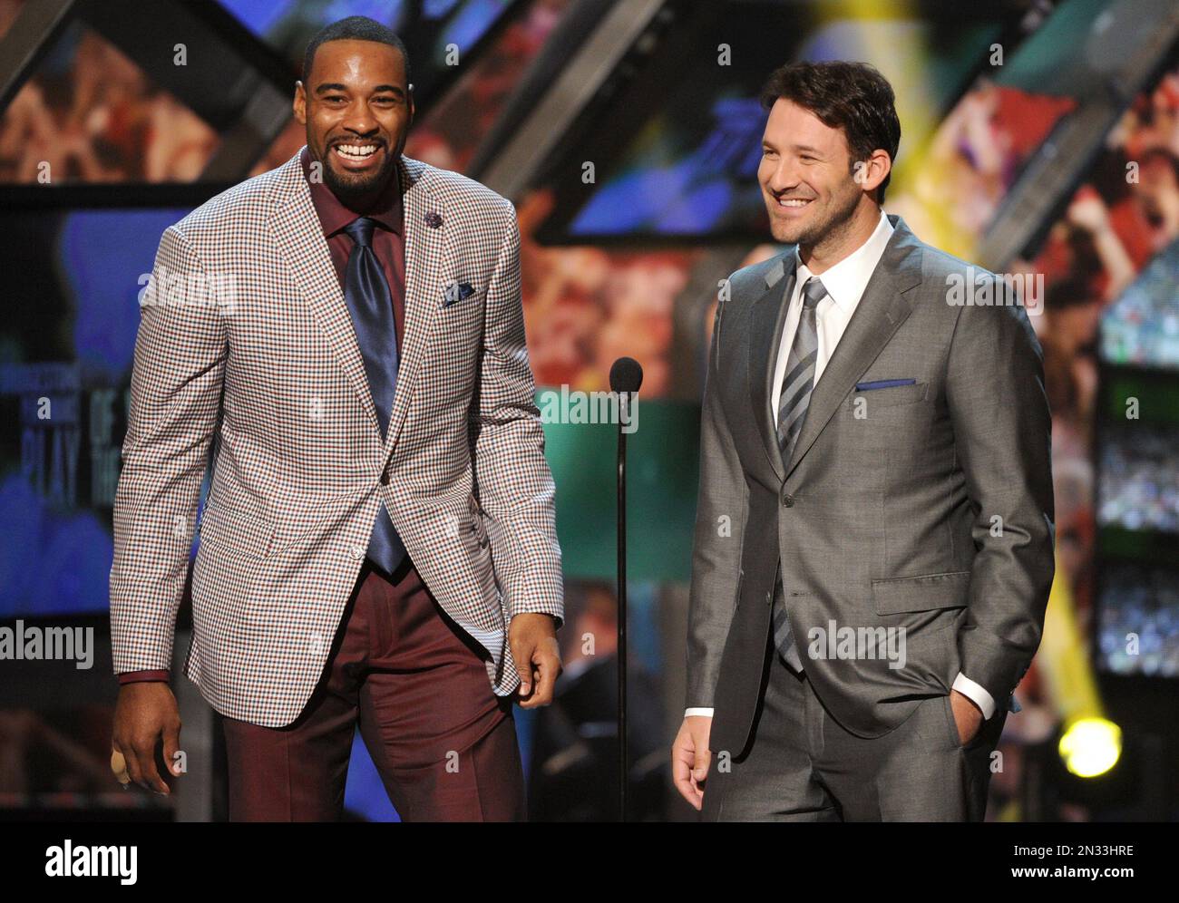 Calvin Johnson, of the Detroit Lions, left, and Tony Romo, of the ...