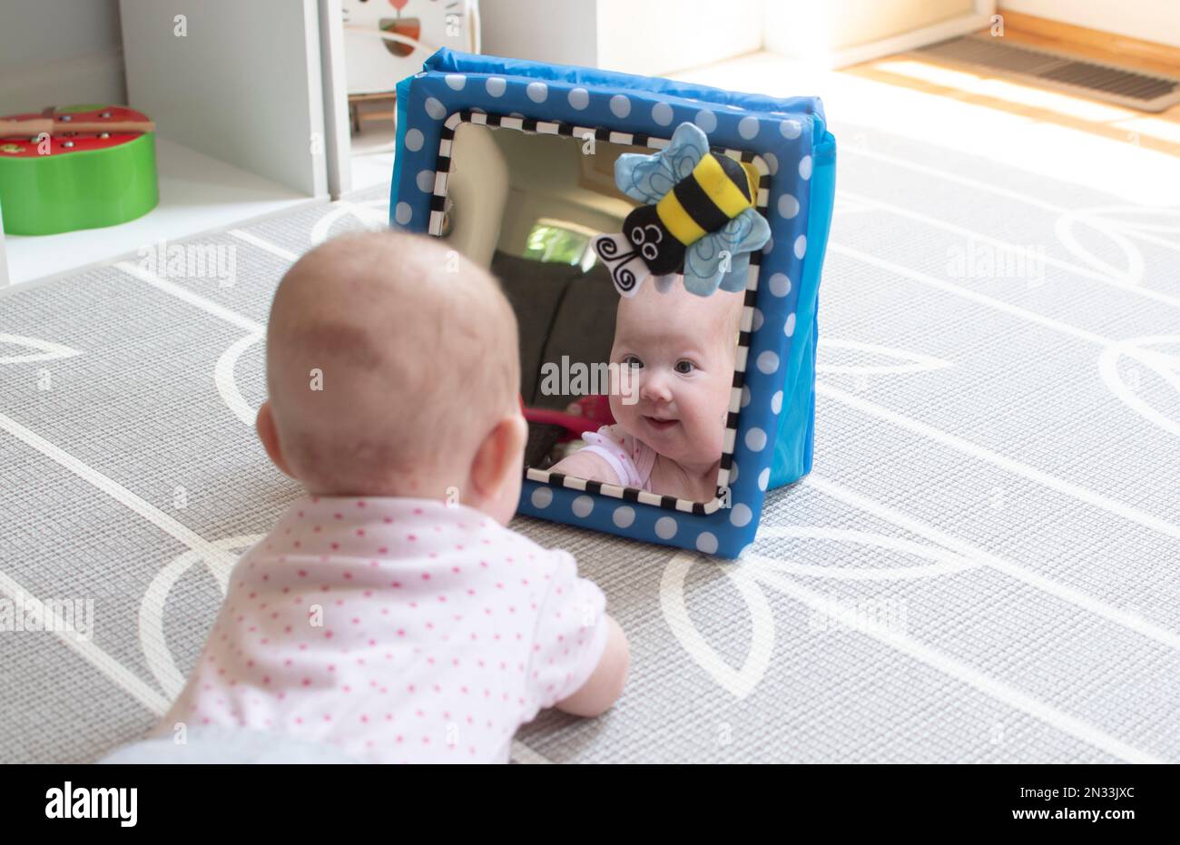 Baby Looking In The Mirror During Tummy Time Stock Photo Alamy