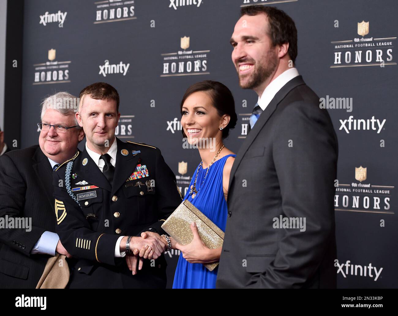 Jared Allen, of the Chicago Bears, right, left, is honored with the 4th ...