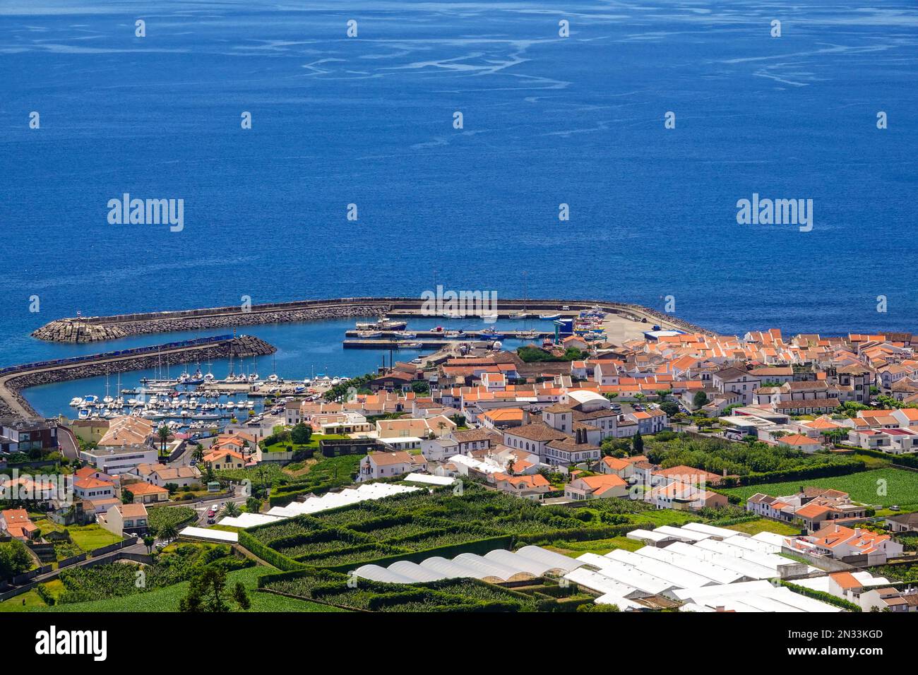 View of the waterfront port with pineapple and banana plantations ...