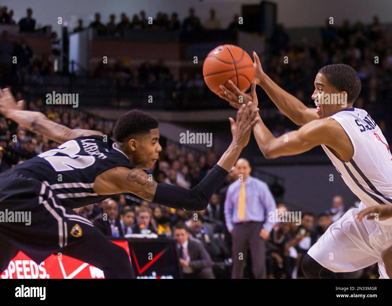 VCU guard Terry Larrier, left, plays defense against Richmond guard ...